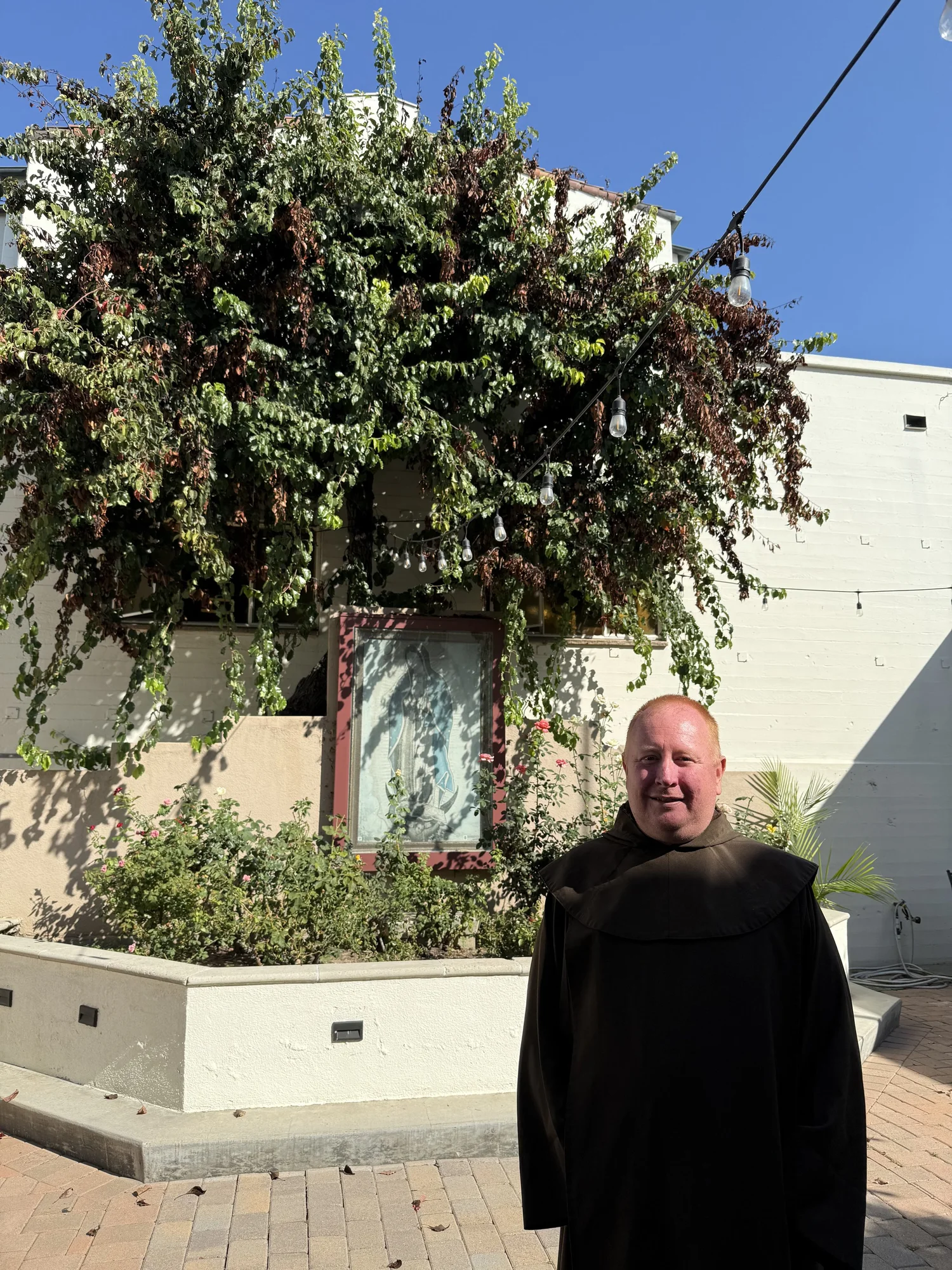 Father Raymond Bueno — Divine Mercy Clinic and Family Center