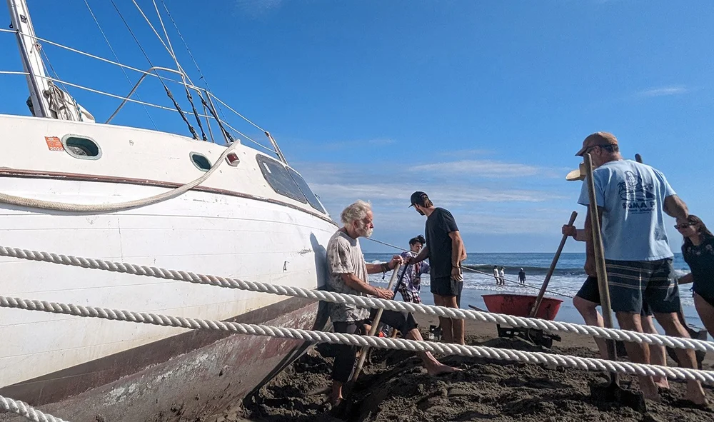 Bob Weir, the beached sailboat, and an ebbing tide — Sam Mondros